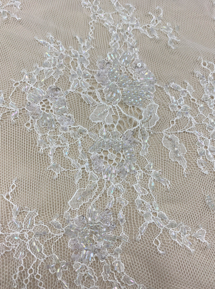 White beaded lace fabric store
