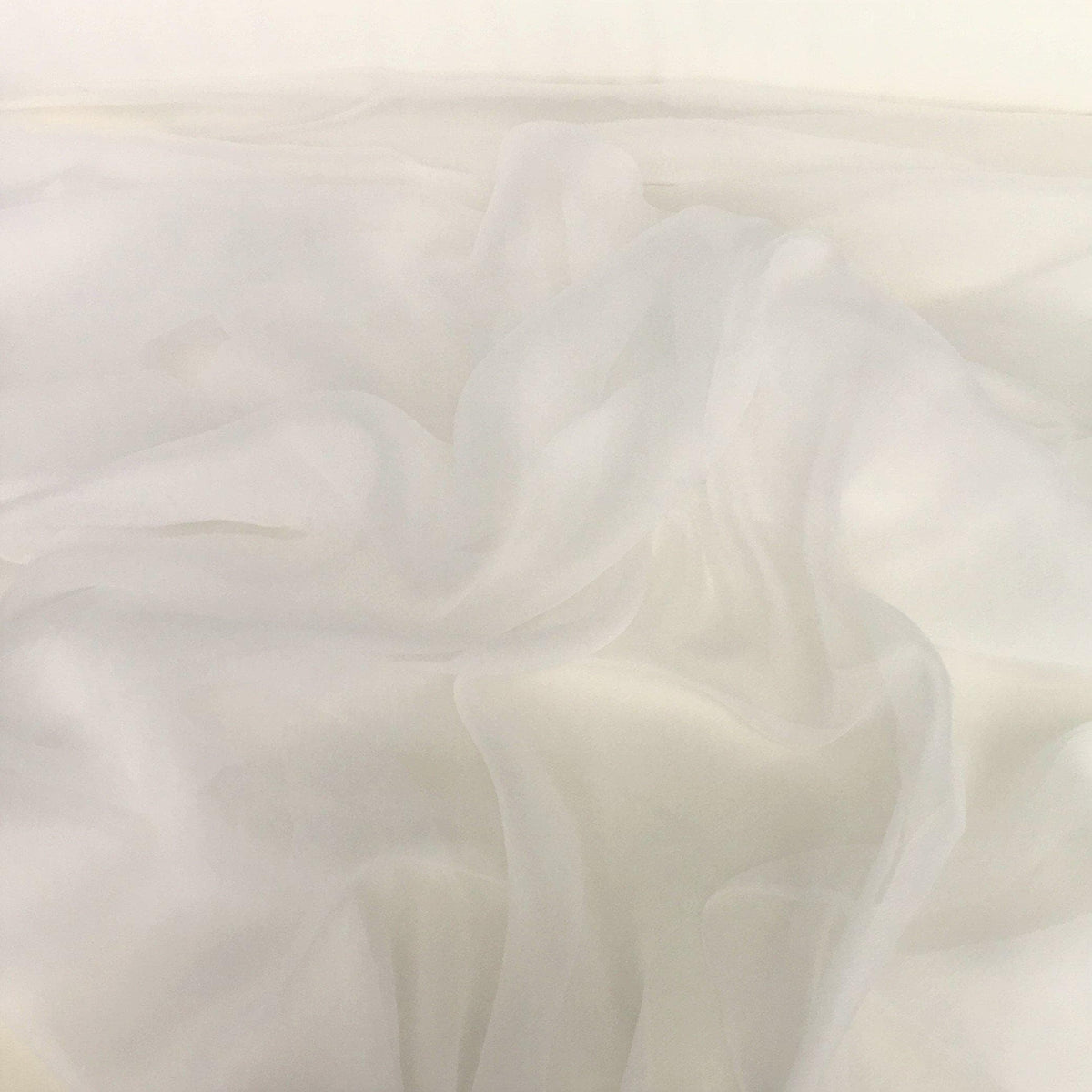 Our Crinkle Chiffon White silk is a lightweight sheer fabric that has a ...